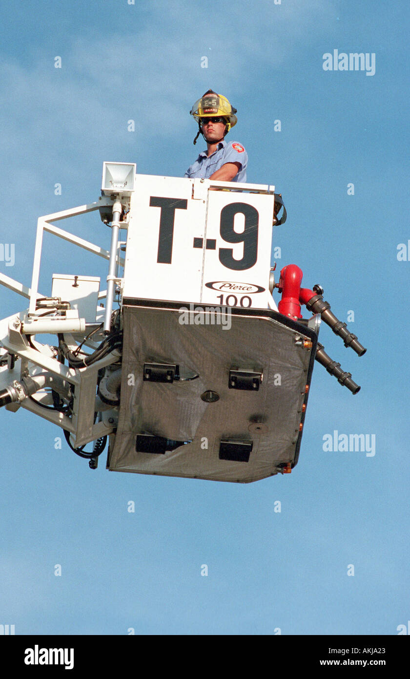 Firefighters demonstrate the use of a extended ladder and boom as part ...