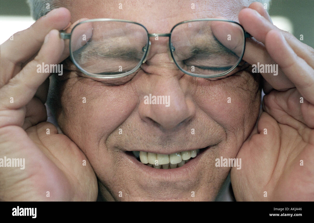 male exhibits symptoms of anguish headaches stress Stock Photo - Alamy