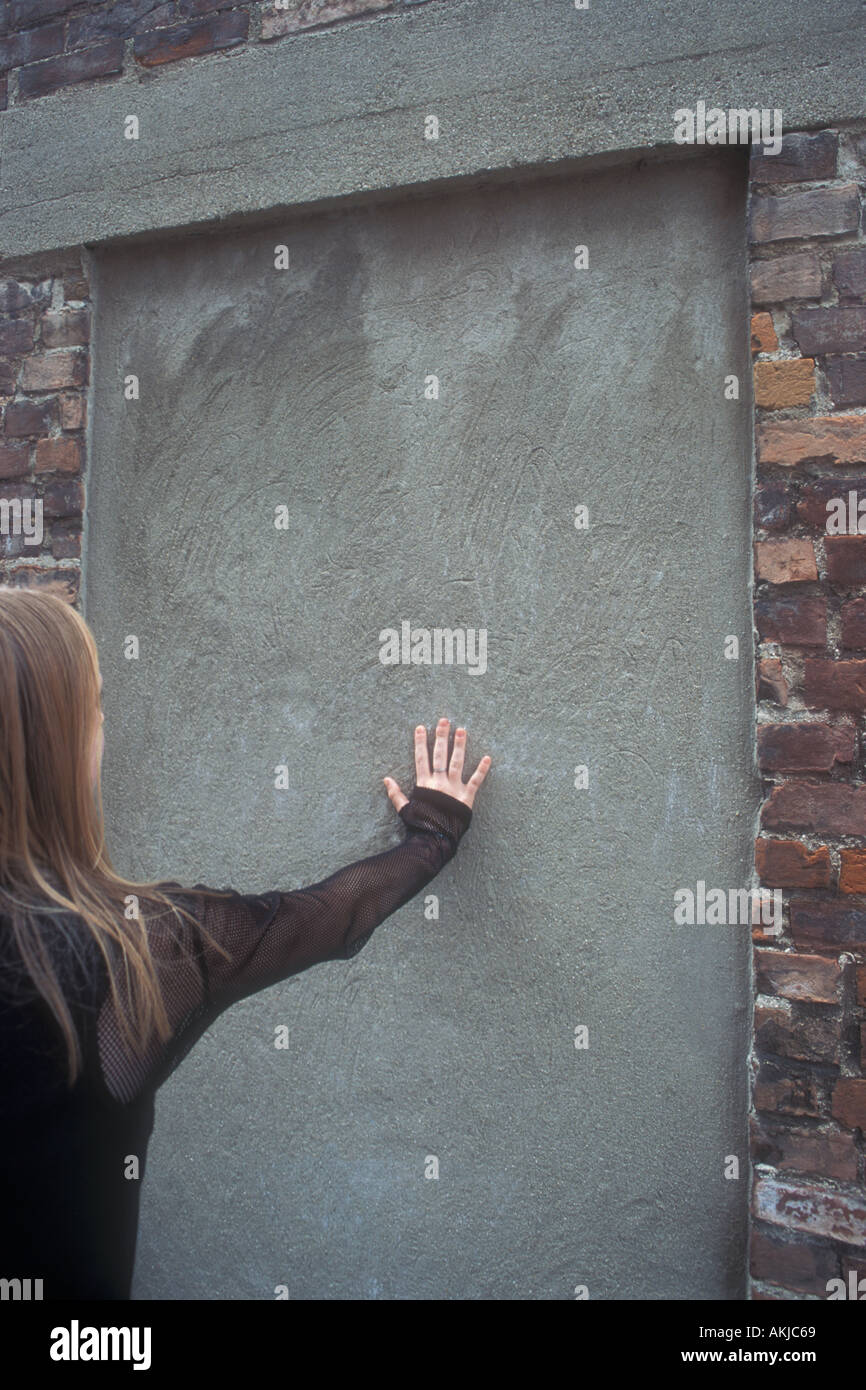Girl touching Wall Stock Photo - Alamy