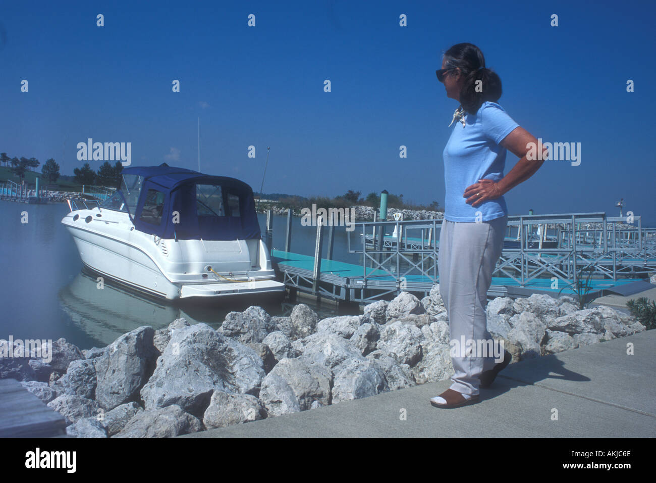 Woman looking at Boat Stock Photo - Alamy