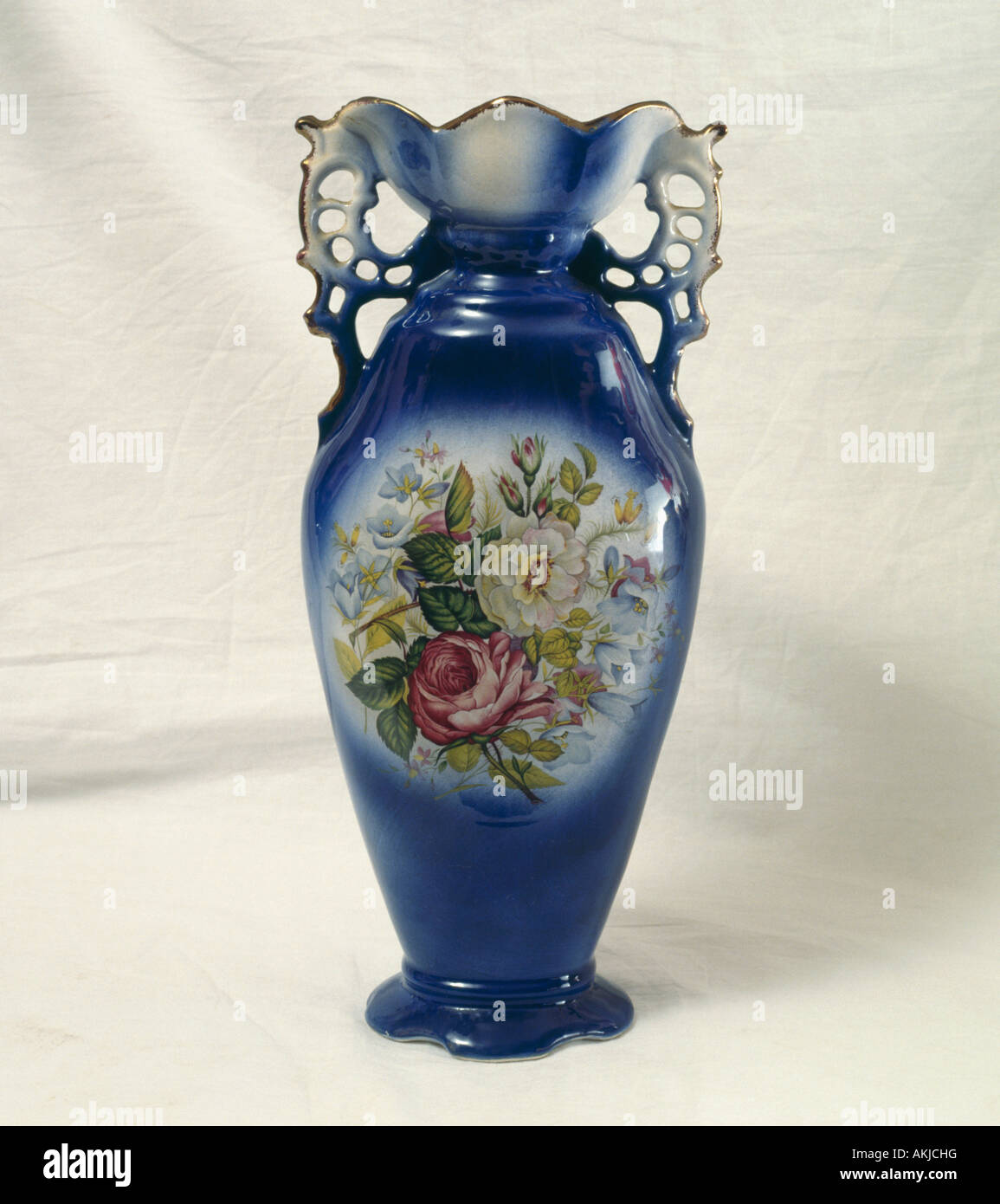 Close up of blue china vase with rose pattern Stock Photo - Alamy