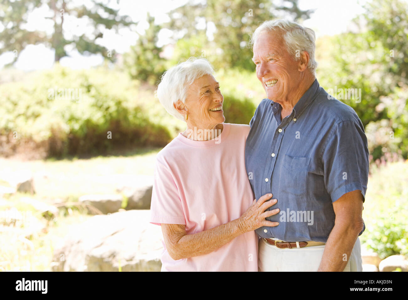 Senior couple hugging Stock Photo - Alamy