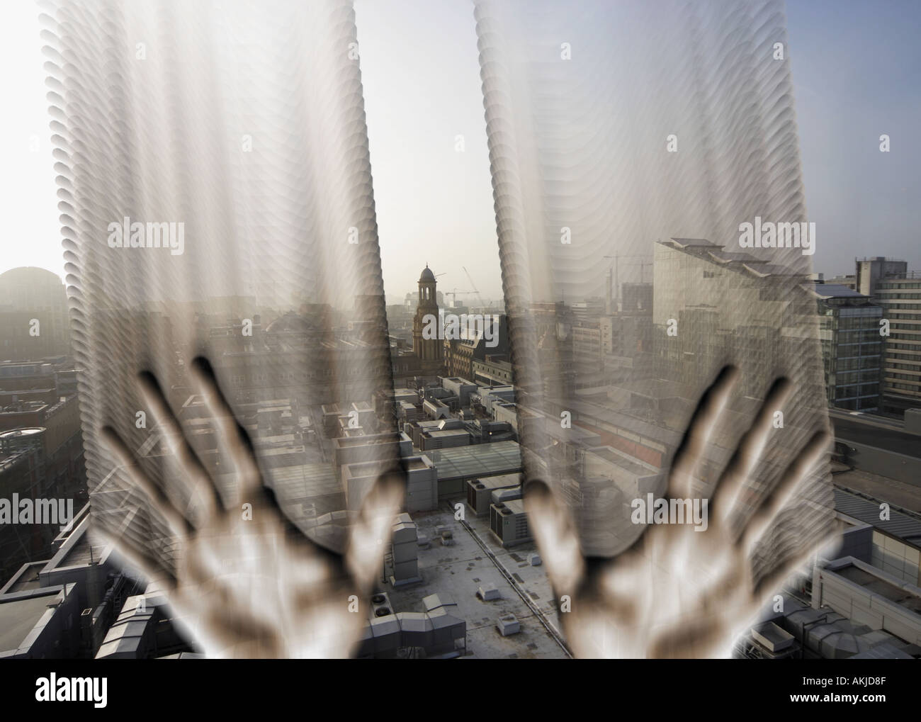 Composite showing falling hands with a cityscape background Stock Photo ...