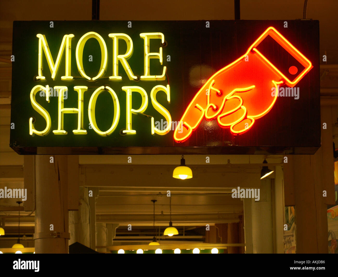 Neon sign of hand pointing to more shops in the Down Under at the Pike ...