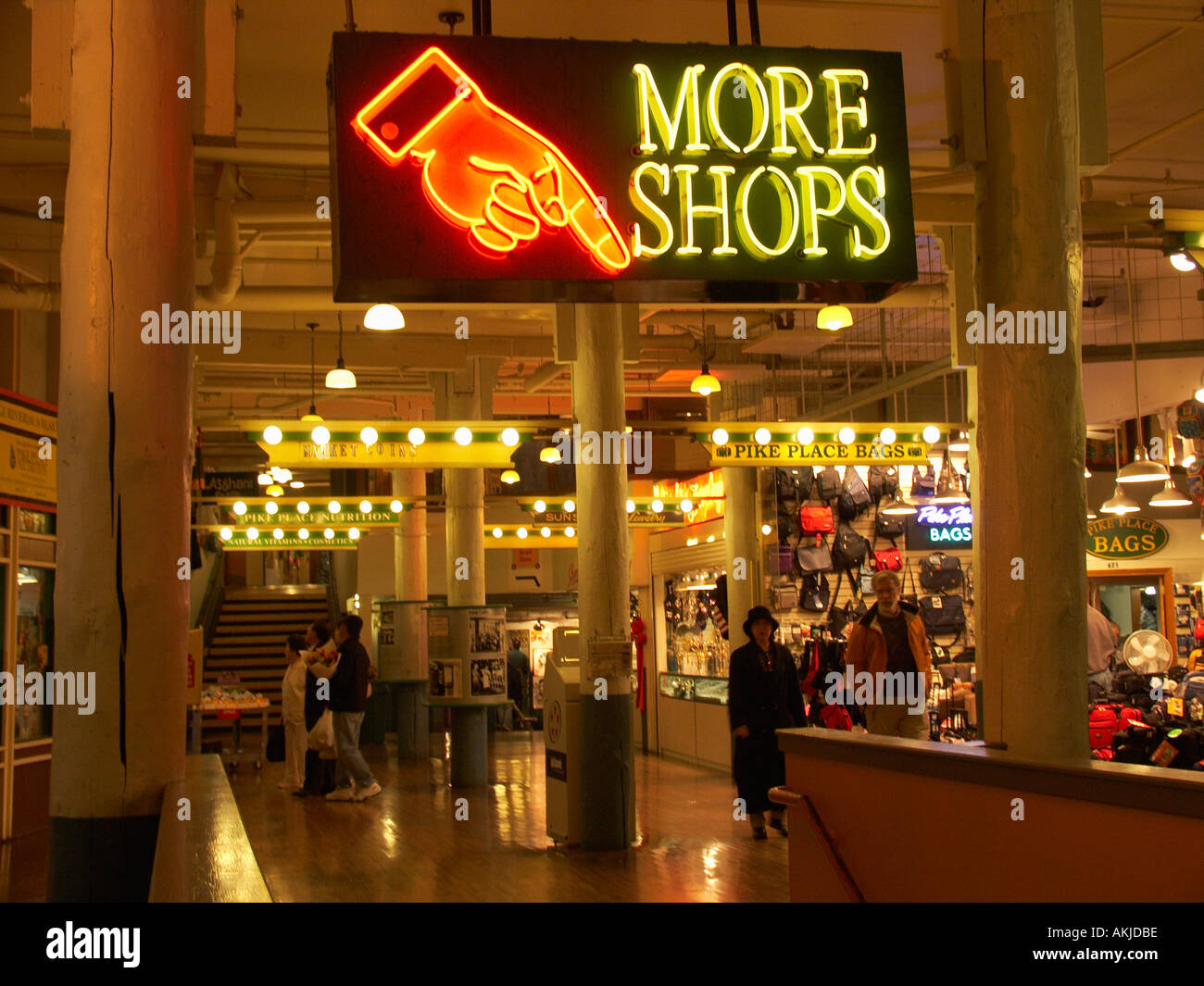 Neon sign of hand pointing to more shops in the Down Under at the Pike ...