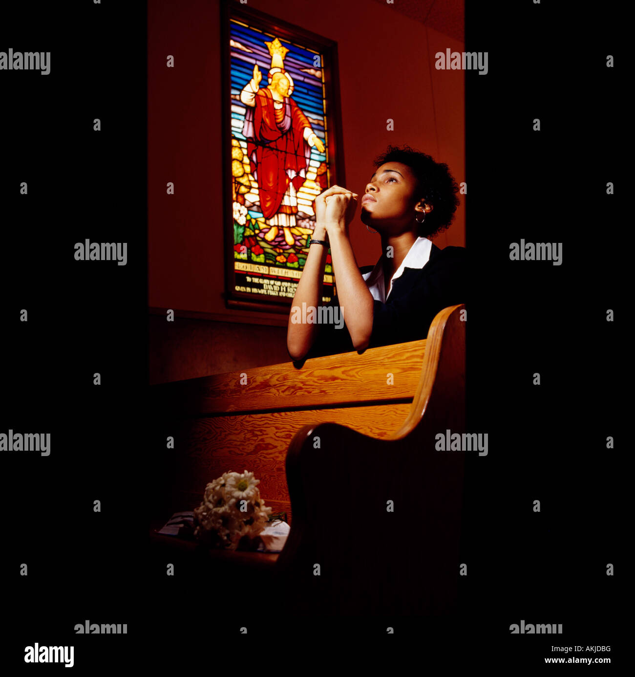 People praying in church hi-res stock photography and images - Alamy