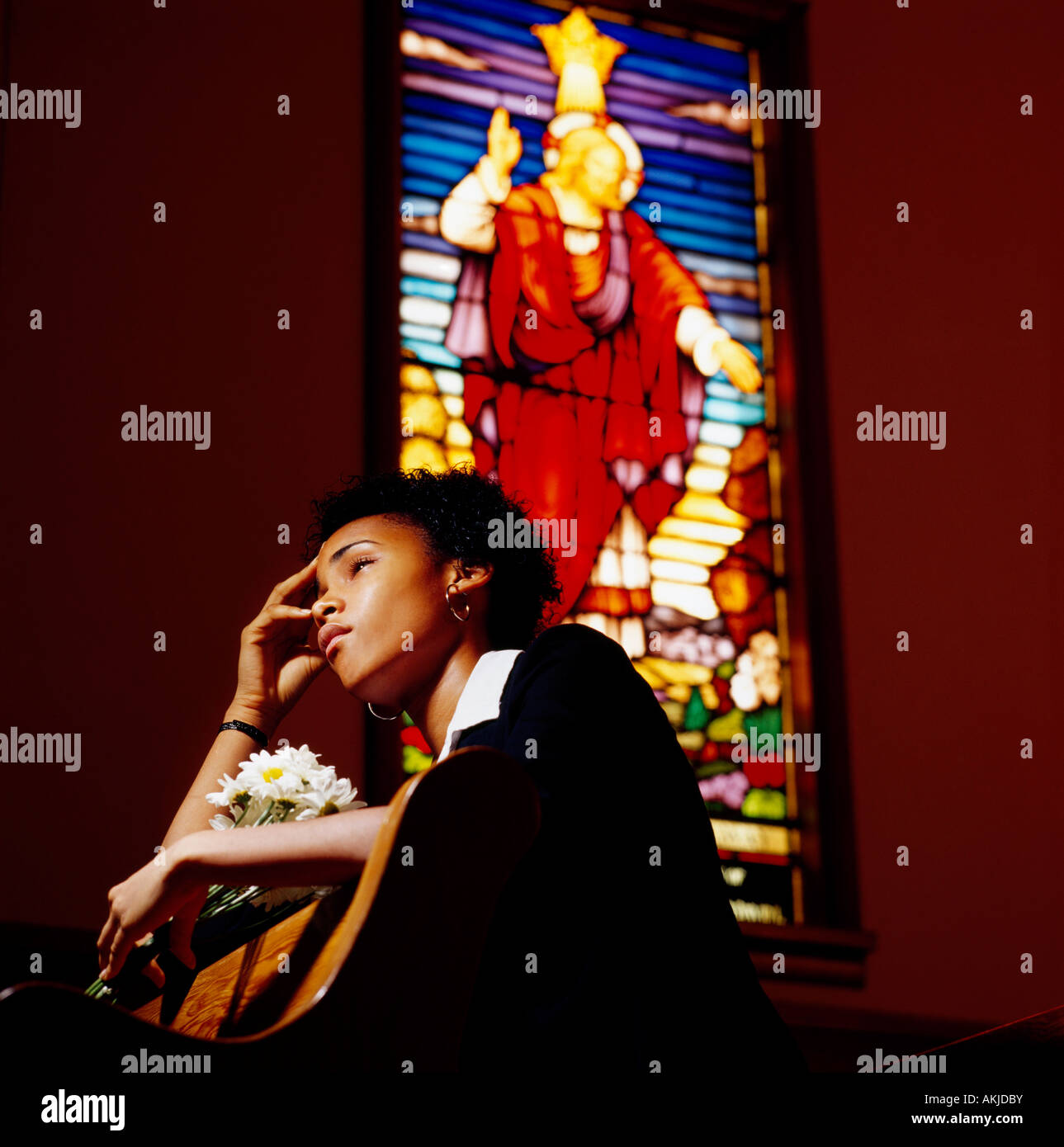 A sad woman in a church Stock Photo - Alamy