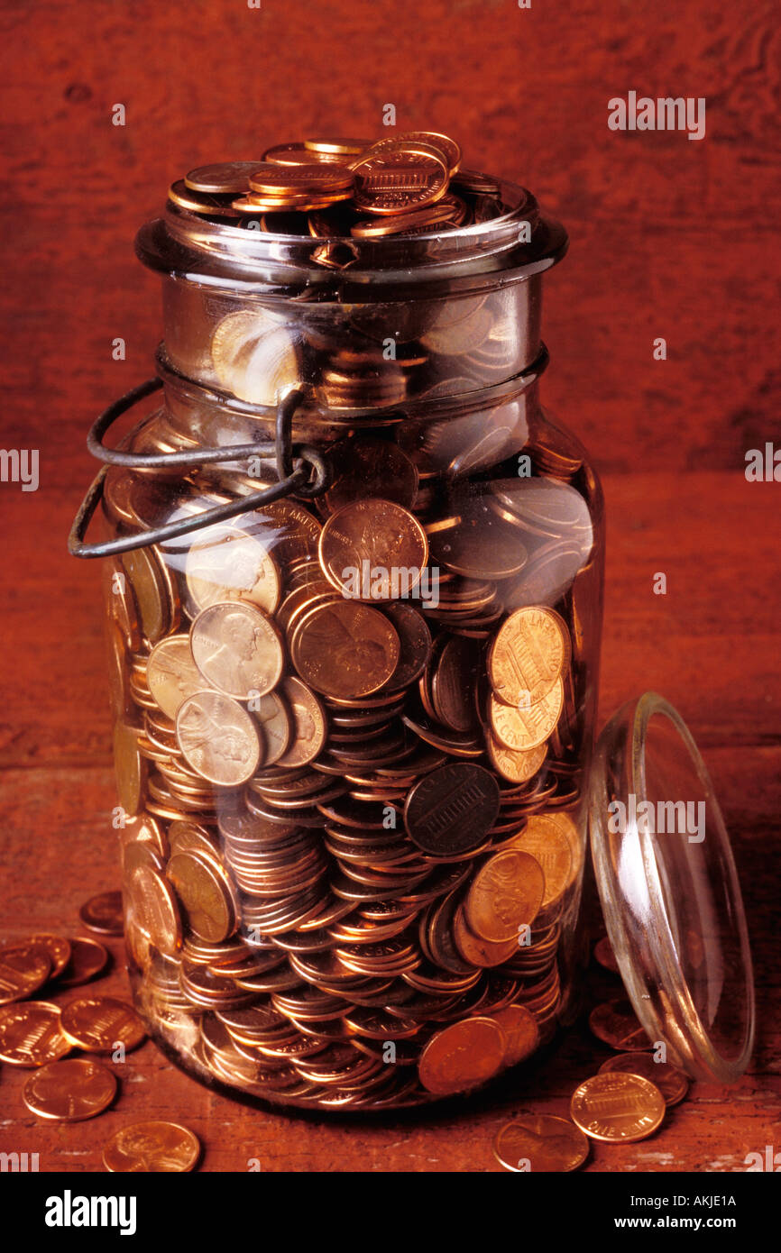 Jar full of pennies Stock Photo - Alamy