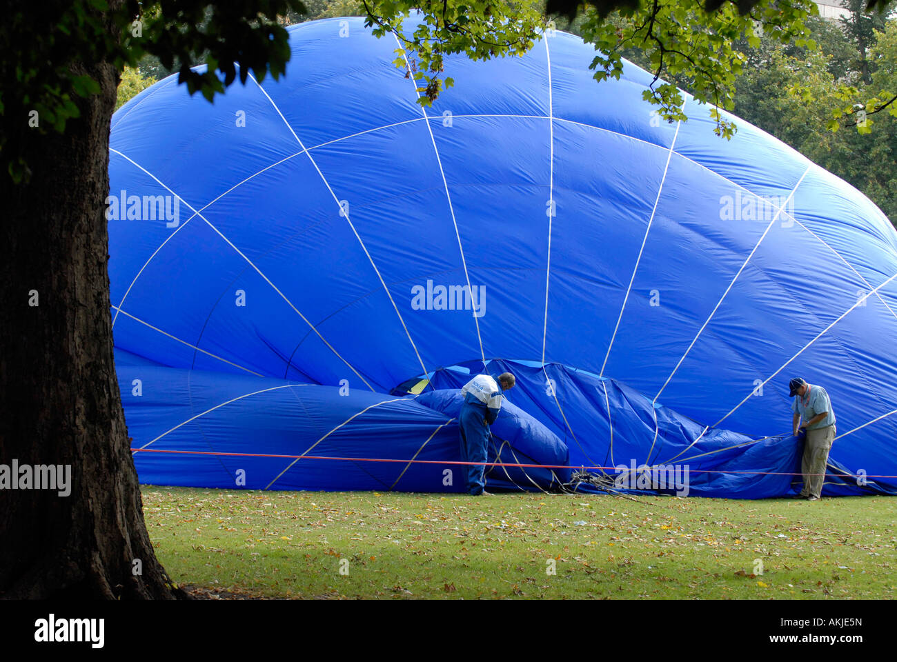 Inflating a blue hot air balloon Stock Photo - Alamy