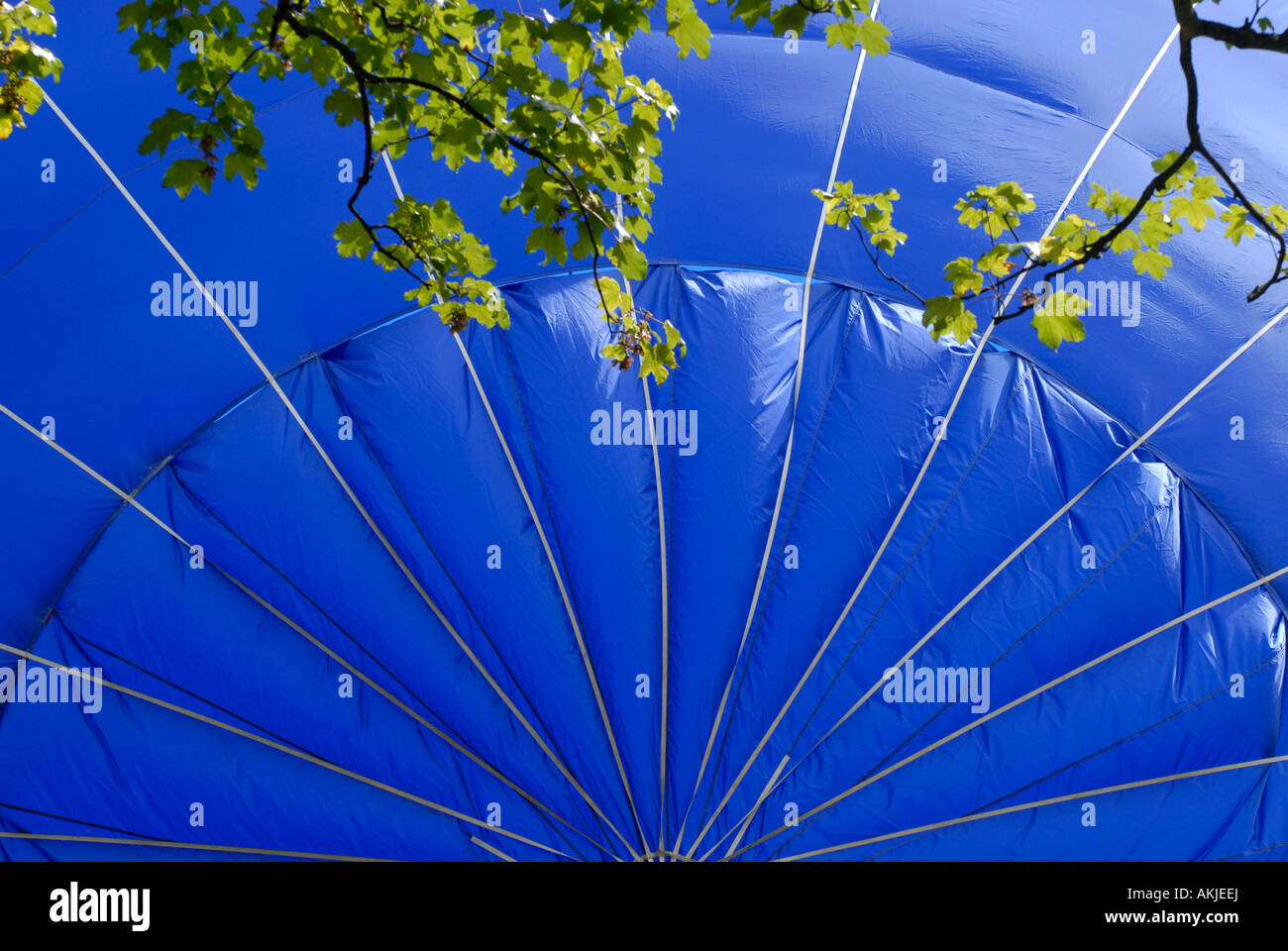 Inflating a blue hot air balloon Stock Photo - Alamy