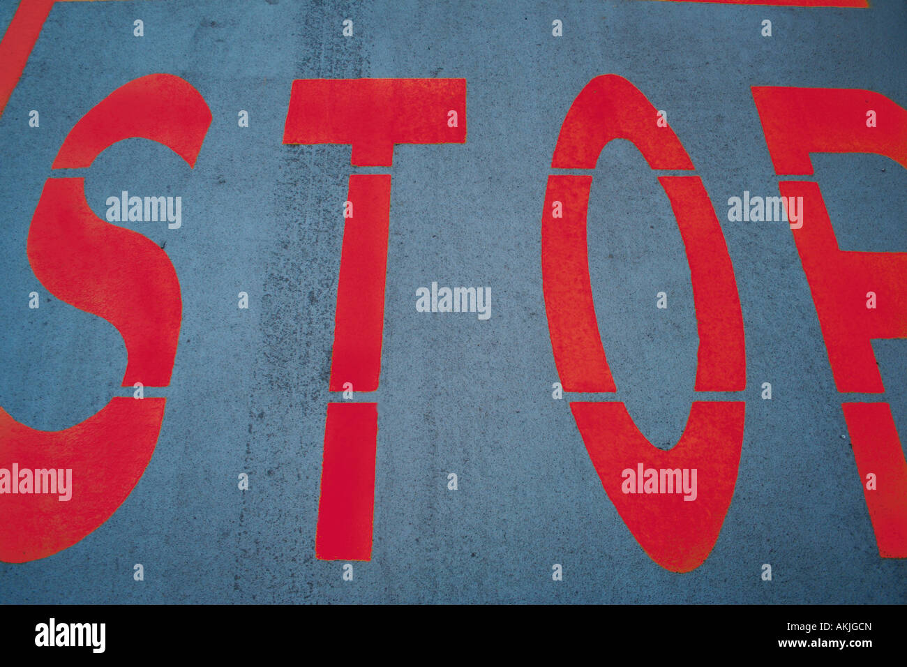 stop painted on pavement in red Stock Photo - Alamy