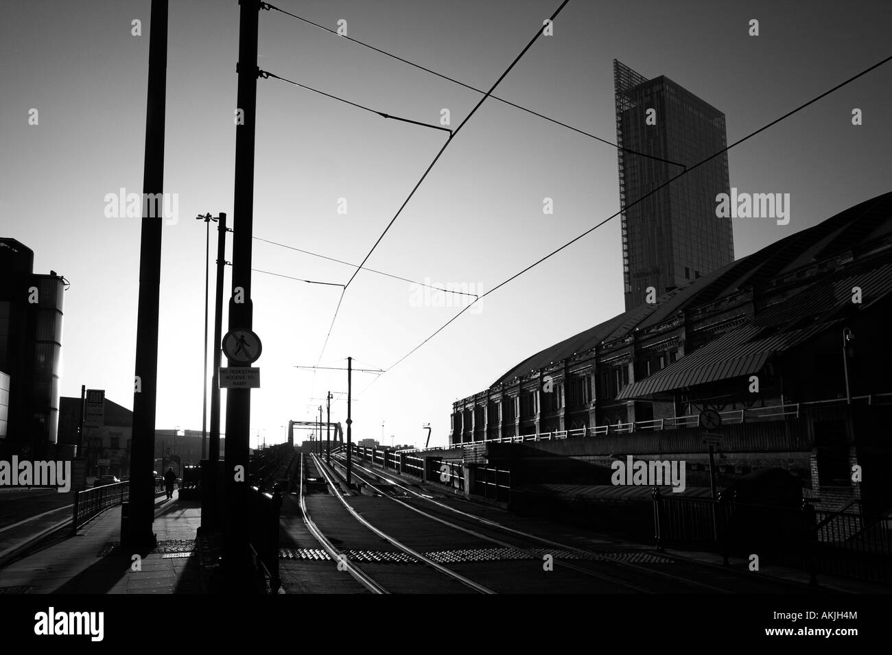 Metrolink tram lines, Lower Mosley Street, with the Hilton Hotel ...