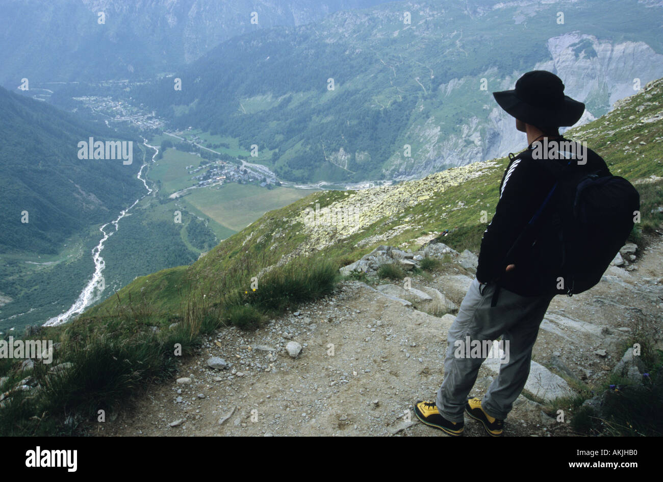Mountaineer looking down a valley in the French Alps Europe Stock Photo ...