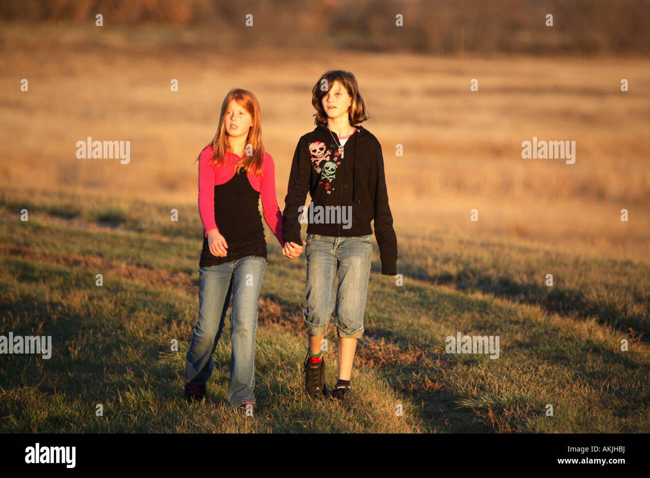 Two girls walking along causeway in scenic Saskatchewan Stock Photo - Alamy