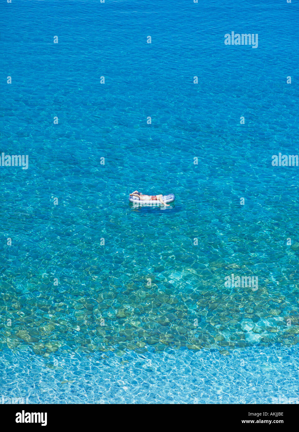 Man floats on a lilo out to sea Stock Photo - Alamy