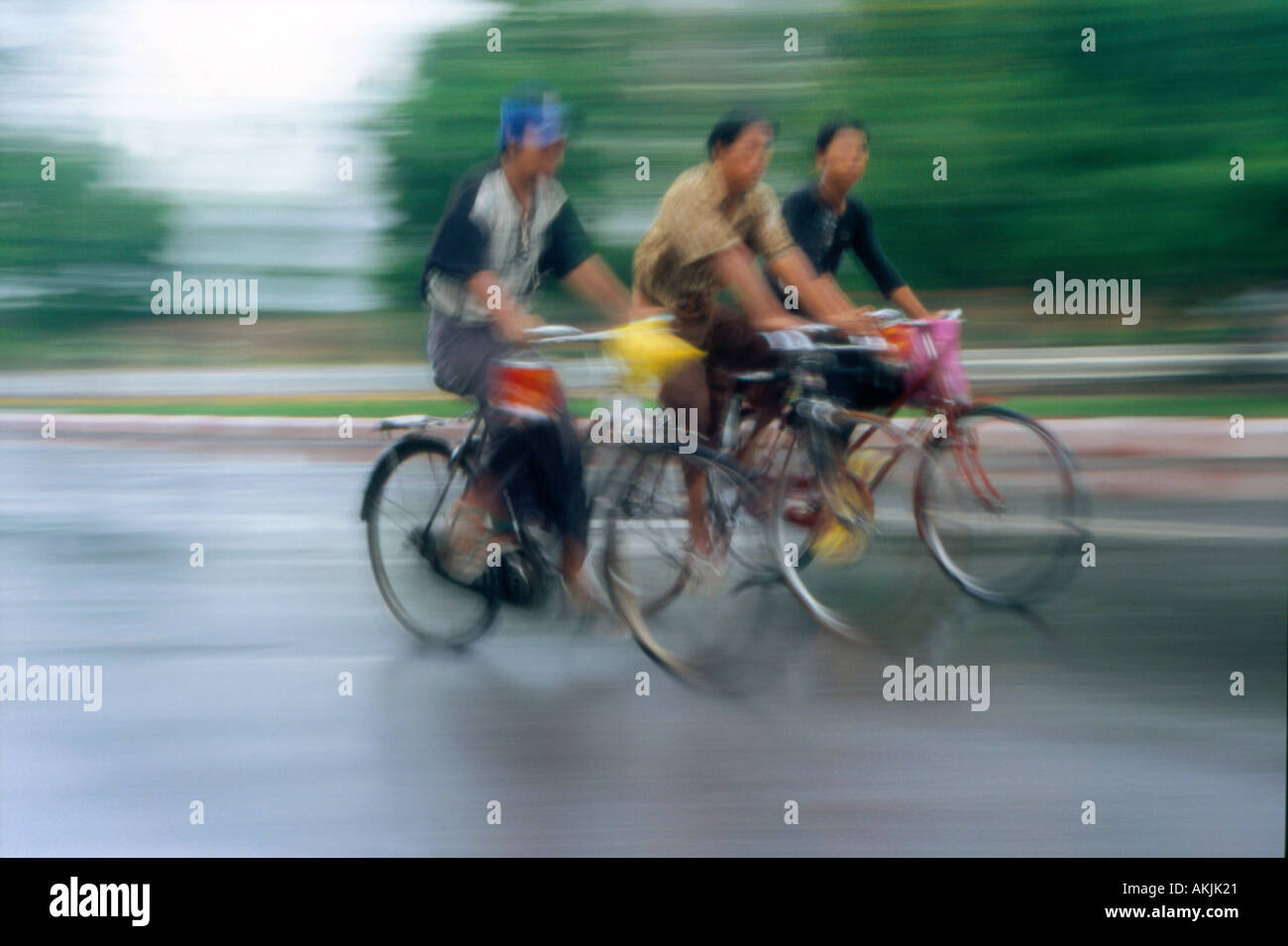 Cyclists in the streets of Mandalay after the rain Mandalay Myanmar Burma Stock Photo - Alamy