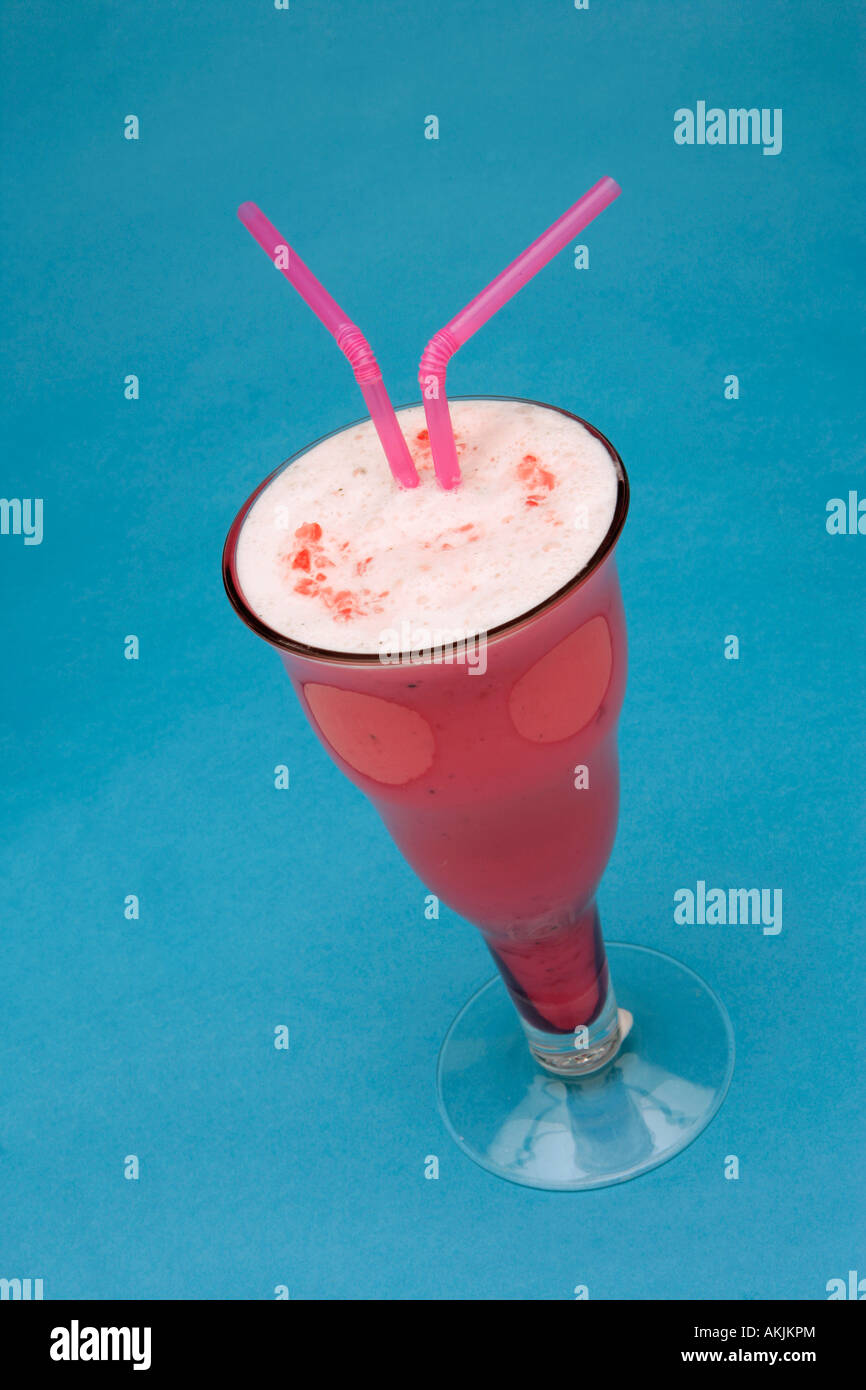 Milkshake with two straws Stock Photo - Alamy