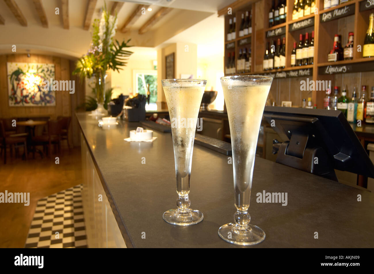 two glasses of chilled champagne on a bar Stock Photo - Alamy