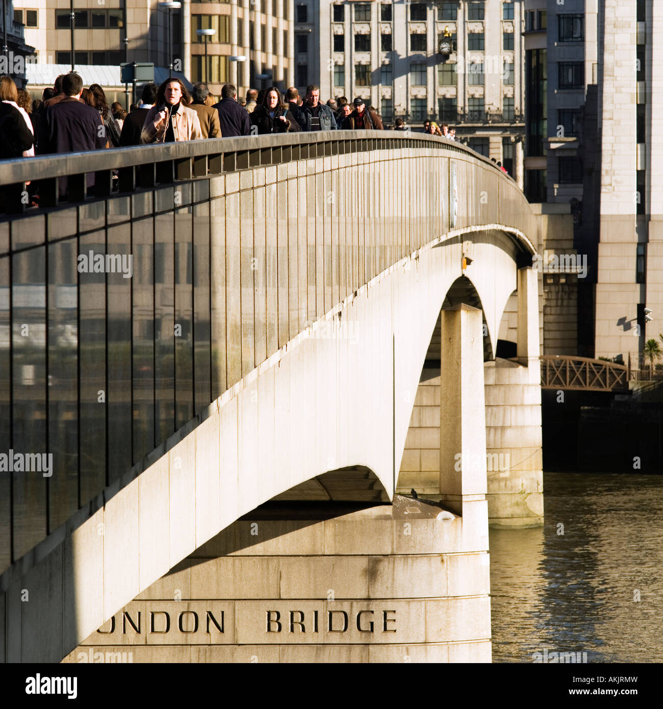Going to work early morning workers crossing London Bridge Stock Photo ...