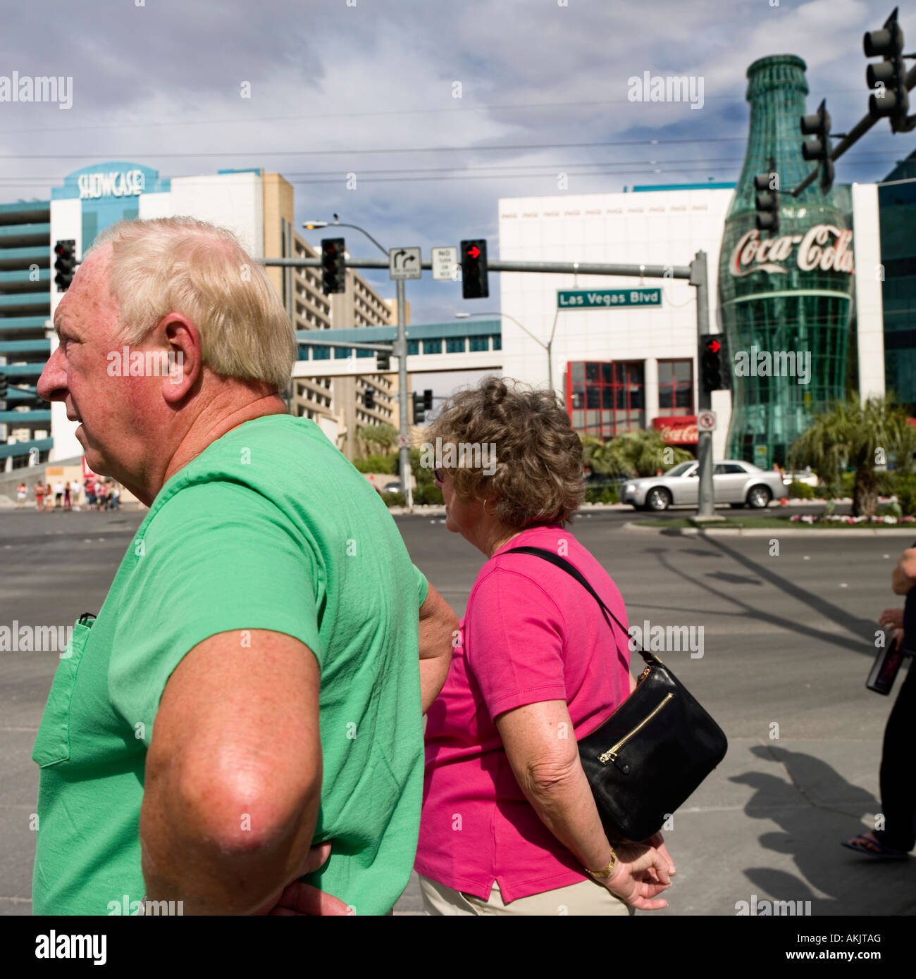 retired couple sight seeing in Las Vegas with giant coca-cola bottle in ...
