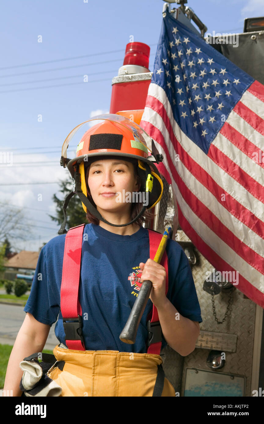 Female firefighter with American flag Stock Photo - Alamy