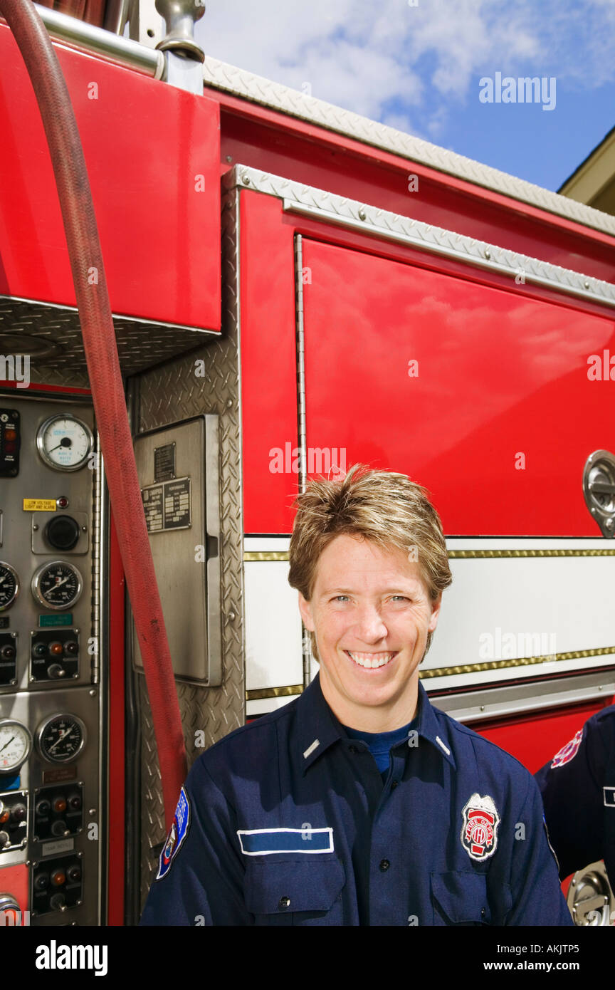 Female firefighter with fire truck Stock Photo - Alamy