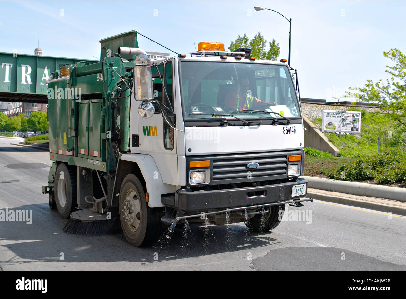 WORKERS Chicago Illinois Street cleaner pass under railroad bridge city ...