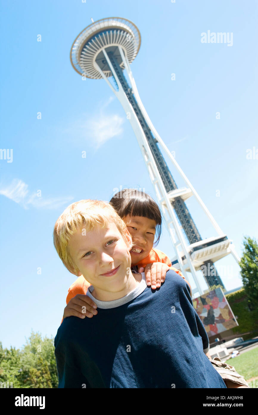 Boy and girl with space needle Stock Photo - Alamy