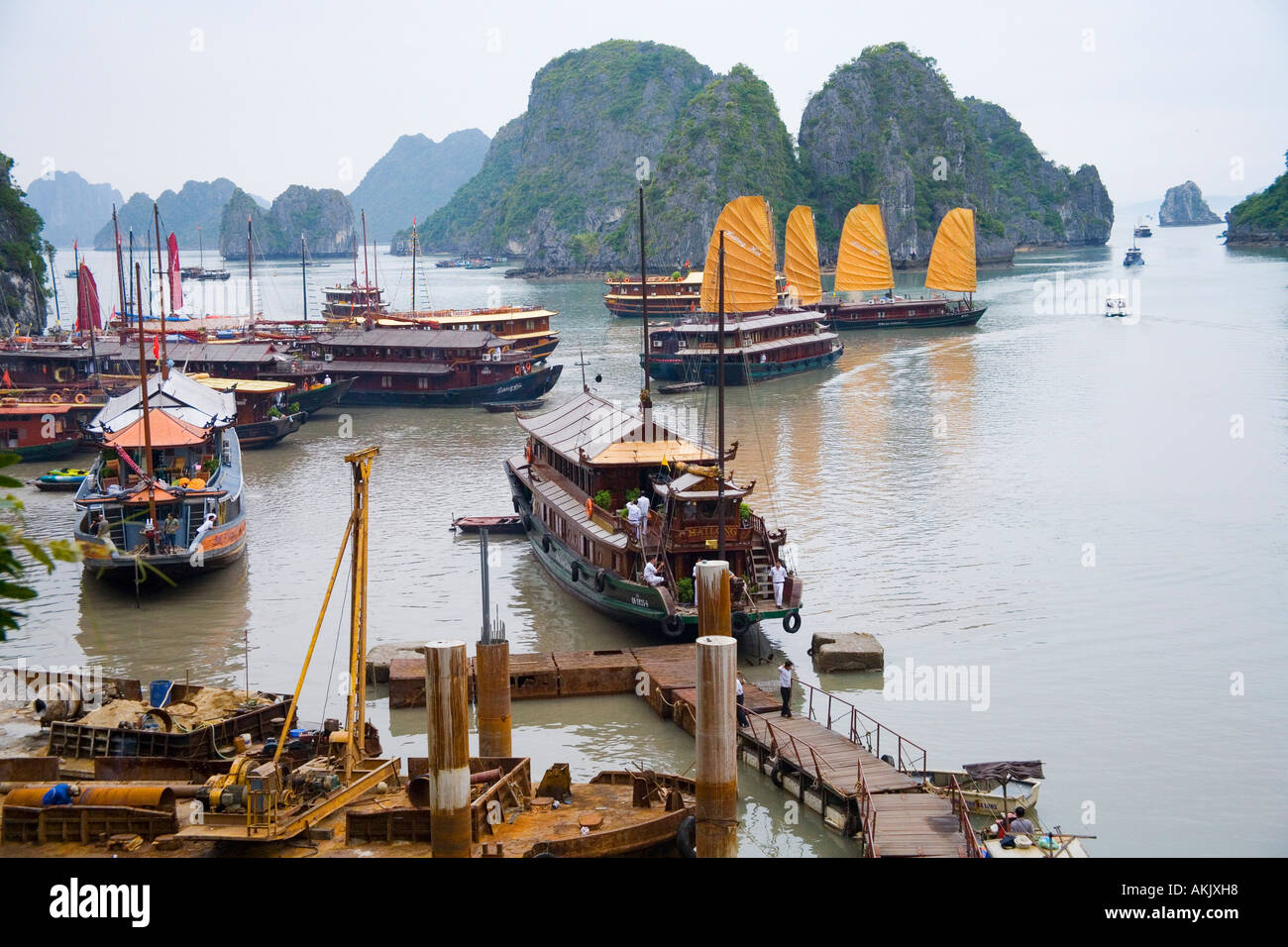 Boats and rocky islands in Vietnamese harbor Stock Photo - Alamy