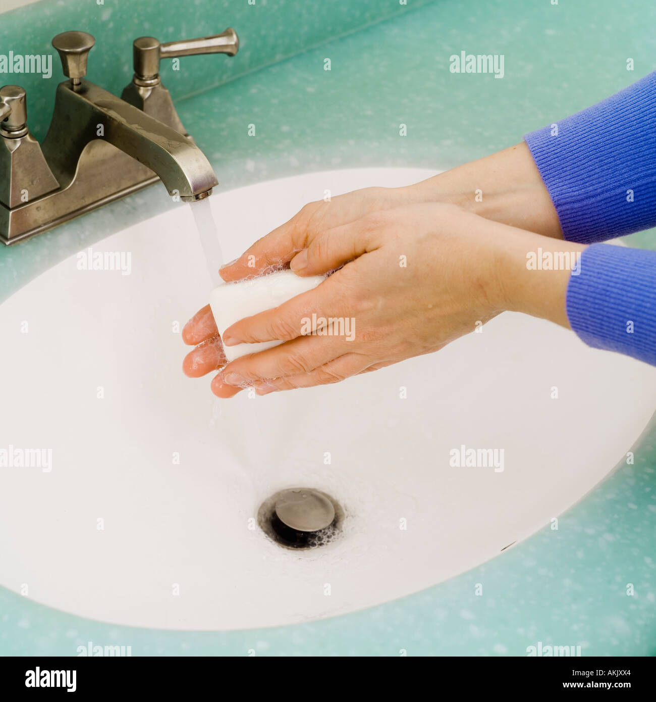 Closeup of washing hands in bathroom sink Stock Photo - Alamy
