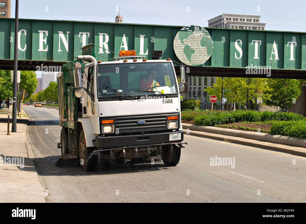 WORKERS Chicago Illinois Street cleaner pass under railroad bridge city ...