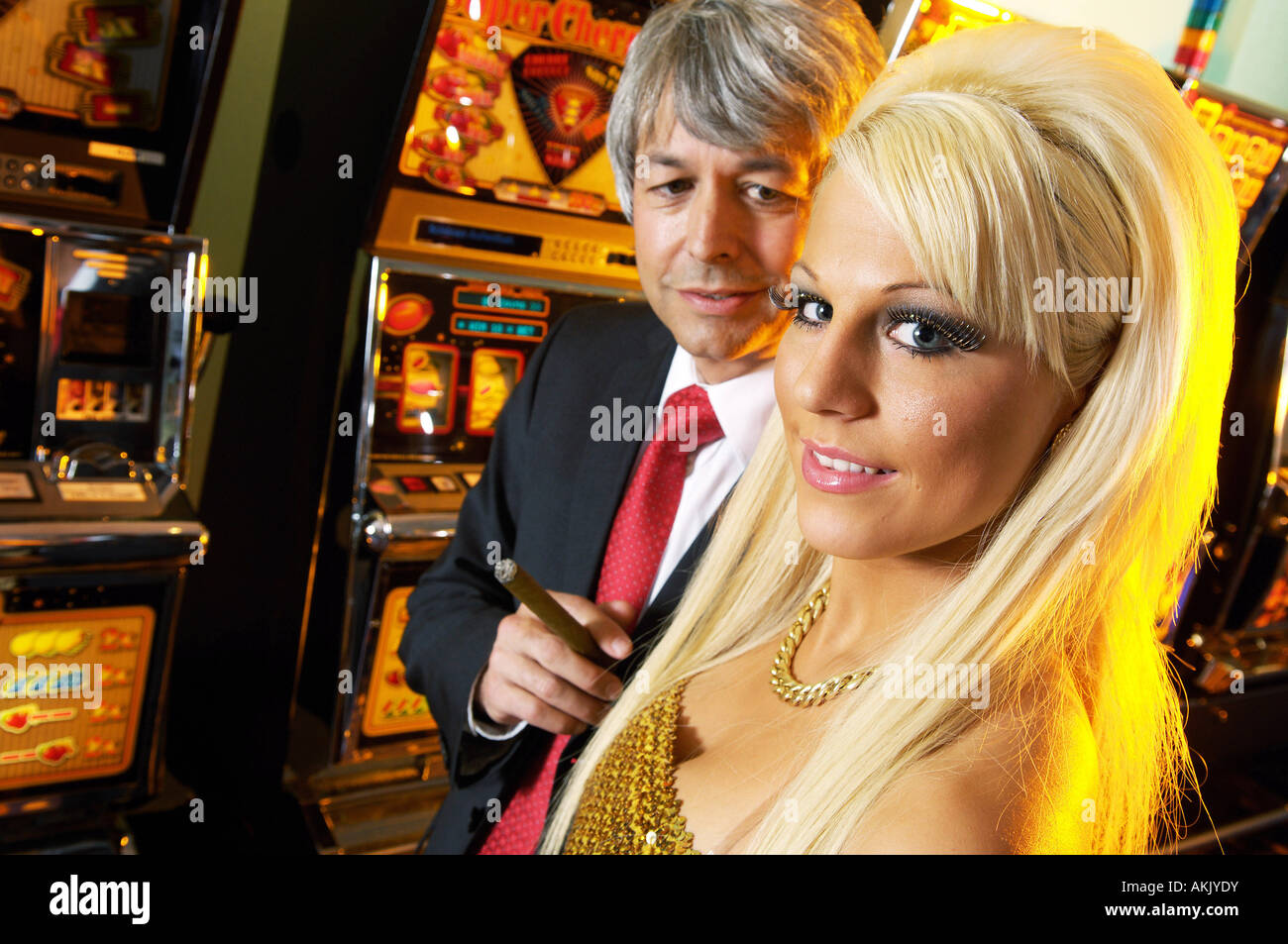 couple playing on a slot machine Stock Photo - Alamy