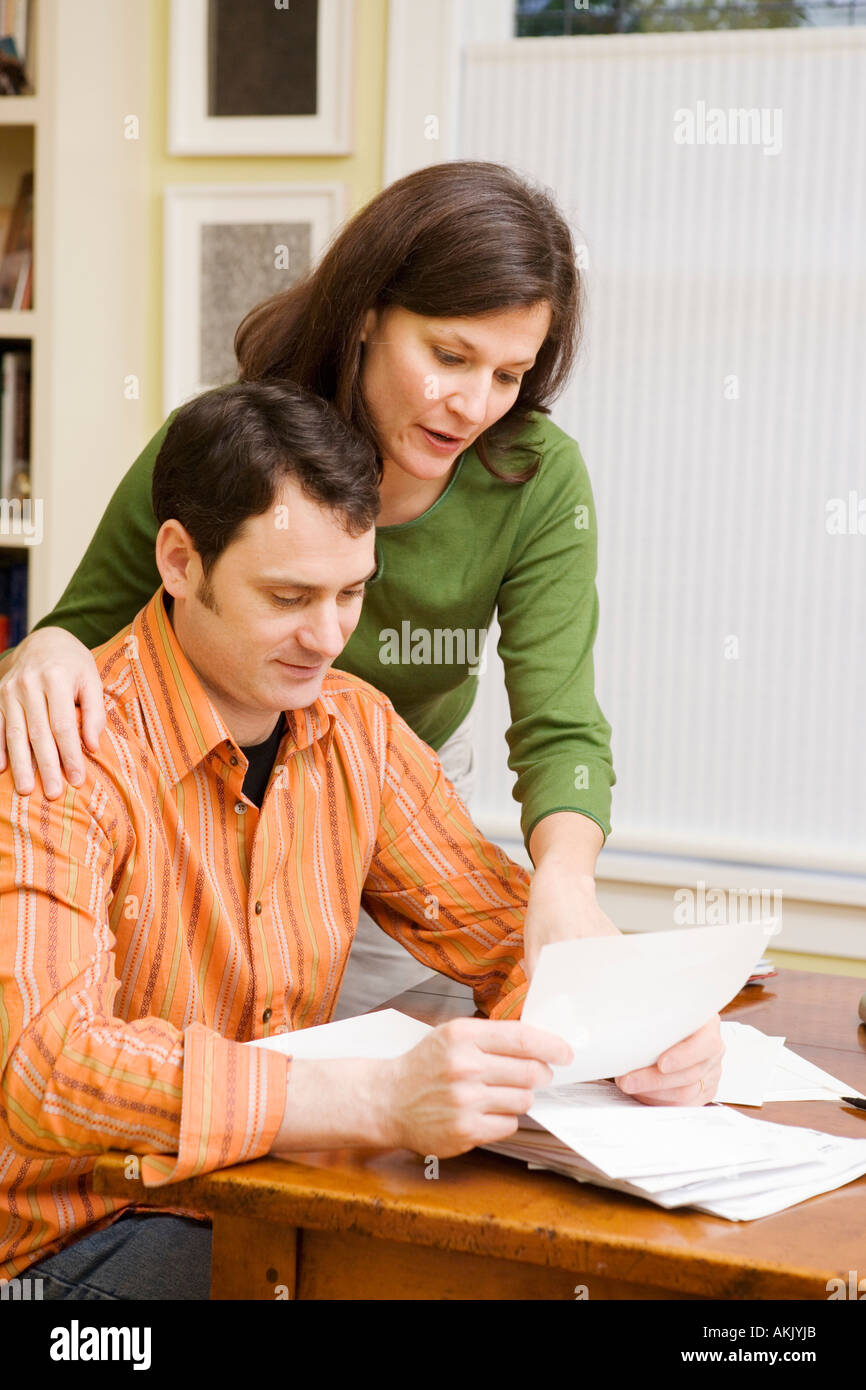 Couple leaning papers hi-res stock photography and images - Alamy