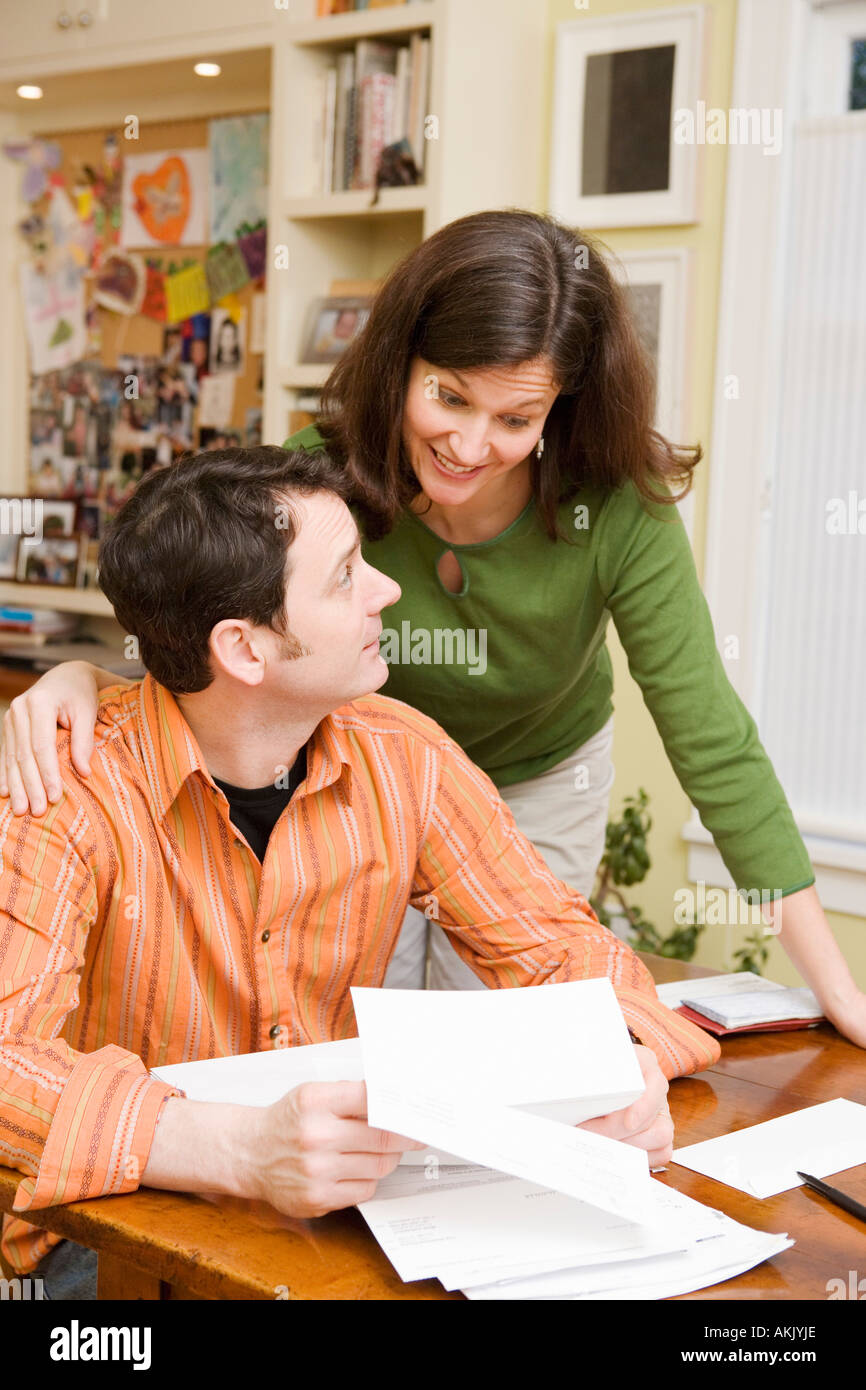 Couple leaning papers hi-res stock photography and images - Alamy