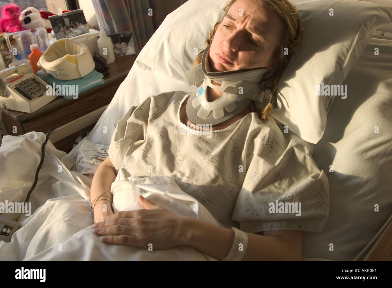 A hospital patient with a neck injury Stock Photo - Alamy