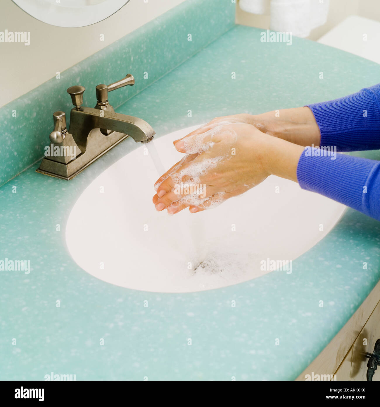 Closeup of washing hands in bathroom sink Stock Photo - Alamy