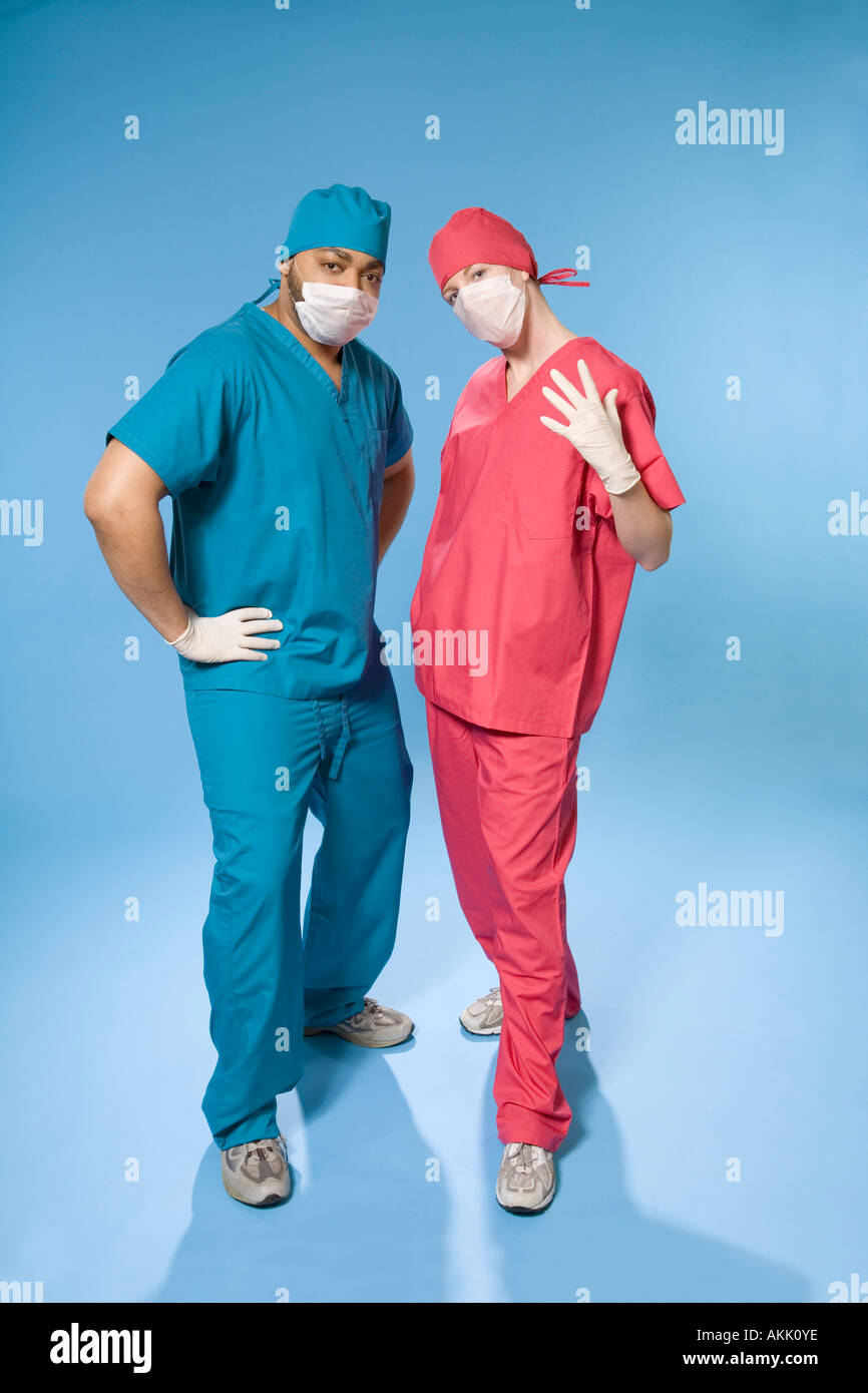 Two full length doctors wearing scrubs Stock Photo - Alamy