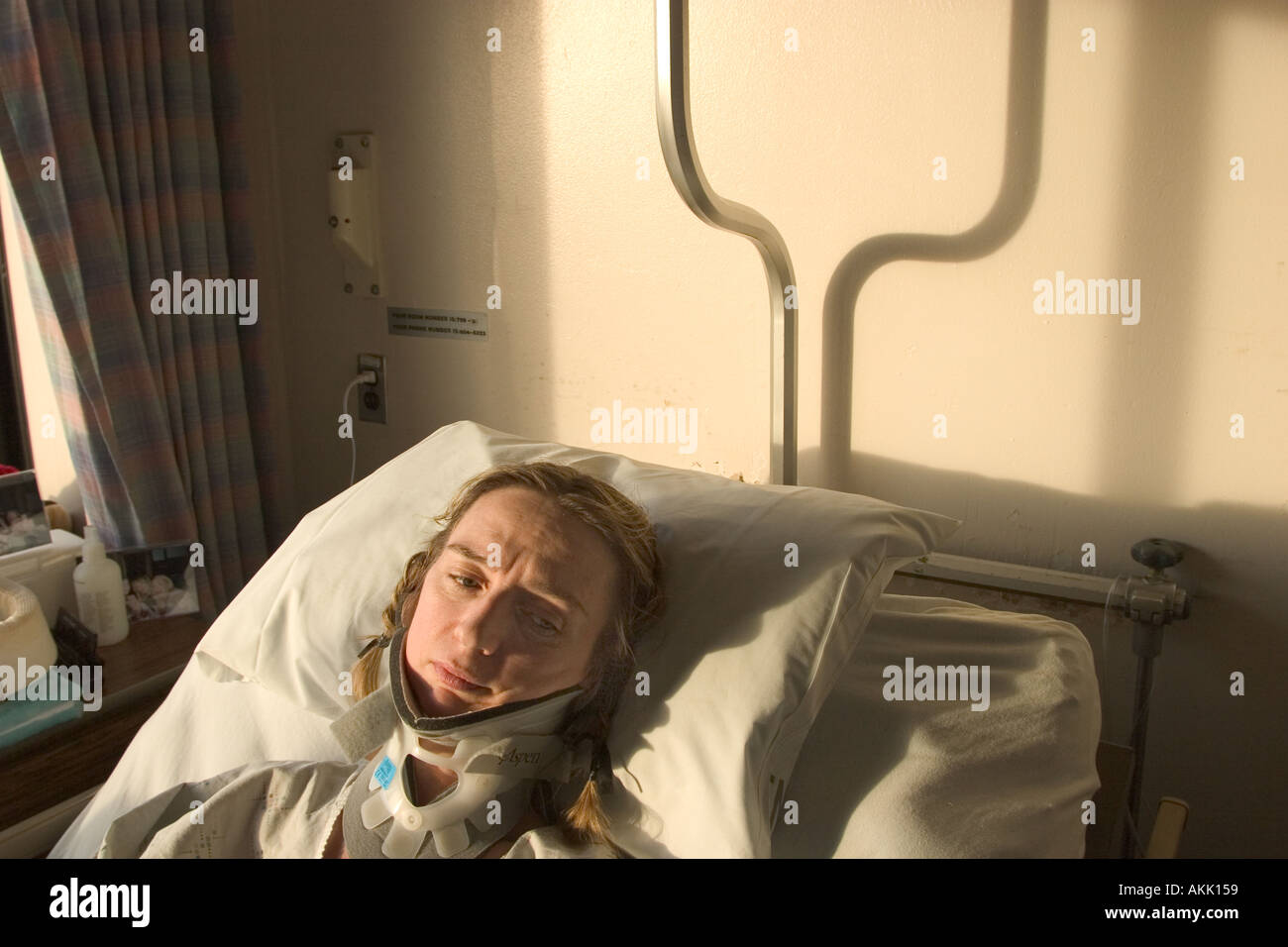 A hospital patient with a neck injury Stock Photo - Alamy