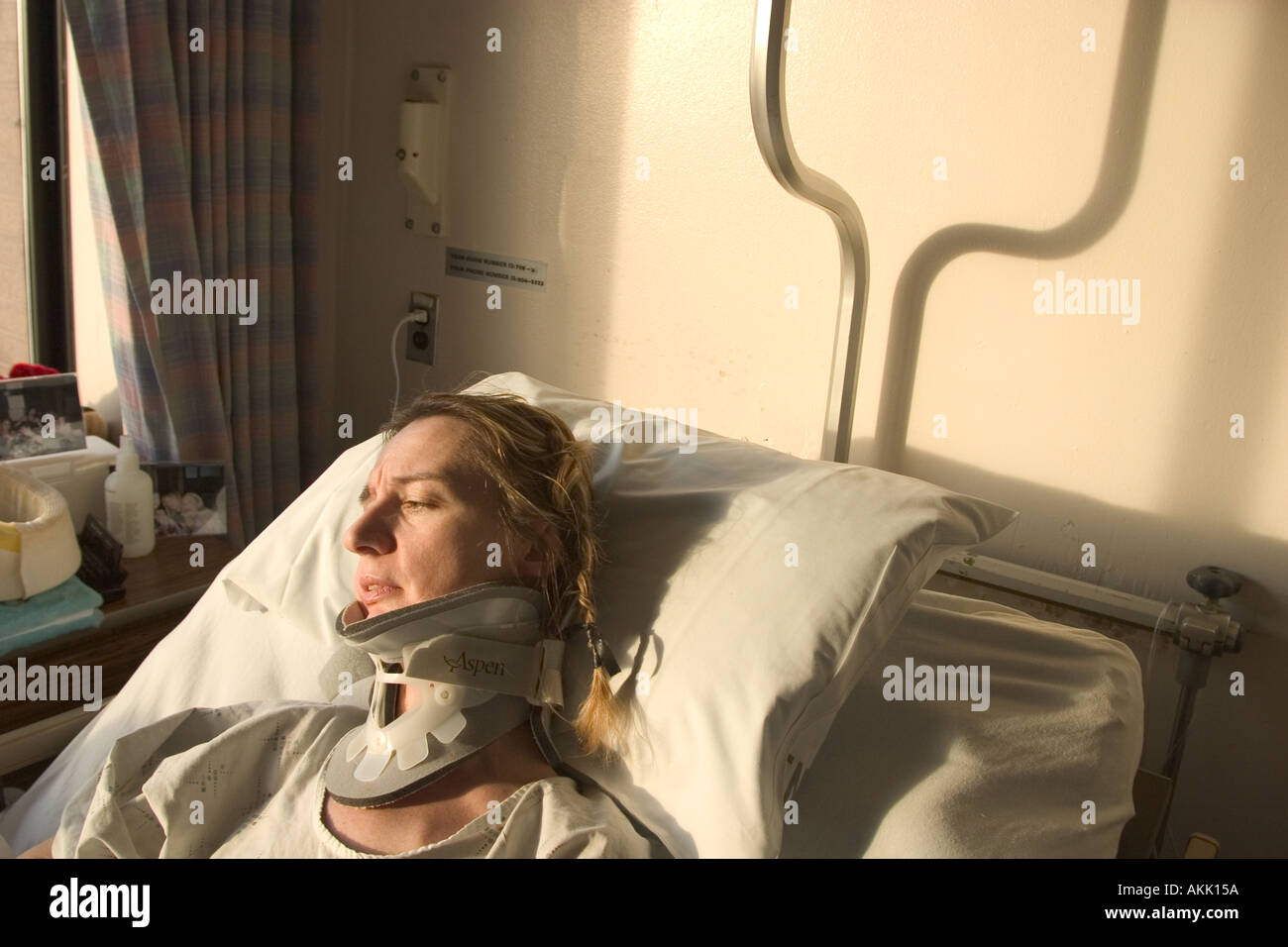 A hospital patient with a neck injury Stock Photo - Alamy