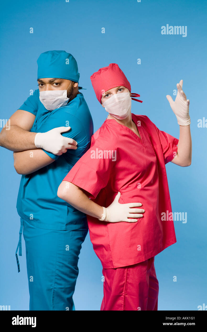 Portrait of two doctors standing back to back Stock Photo - Alamy