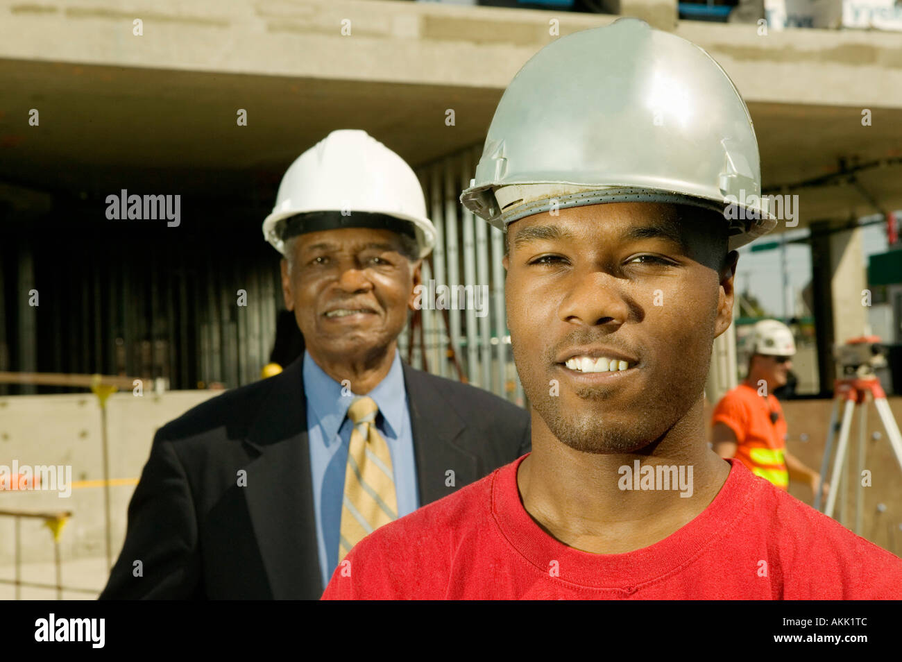 Portrait of construction worker and businessman Stock Photo - Alamy