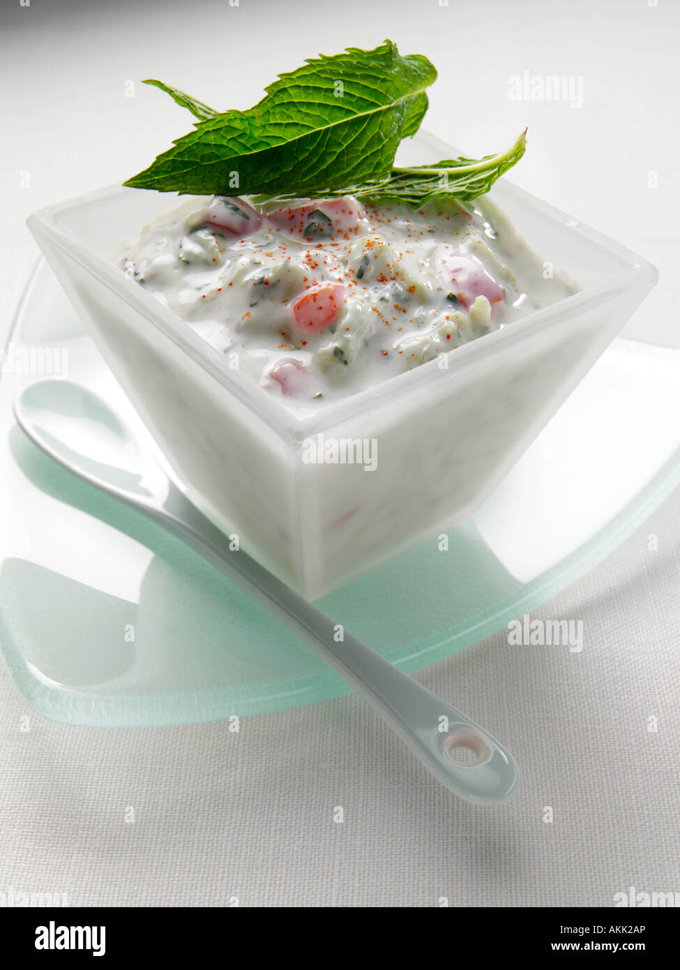 A dish of Indian cucumber and tomato raita vegetarian editorial food ...