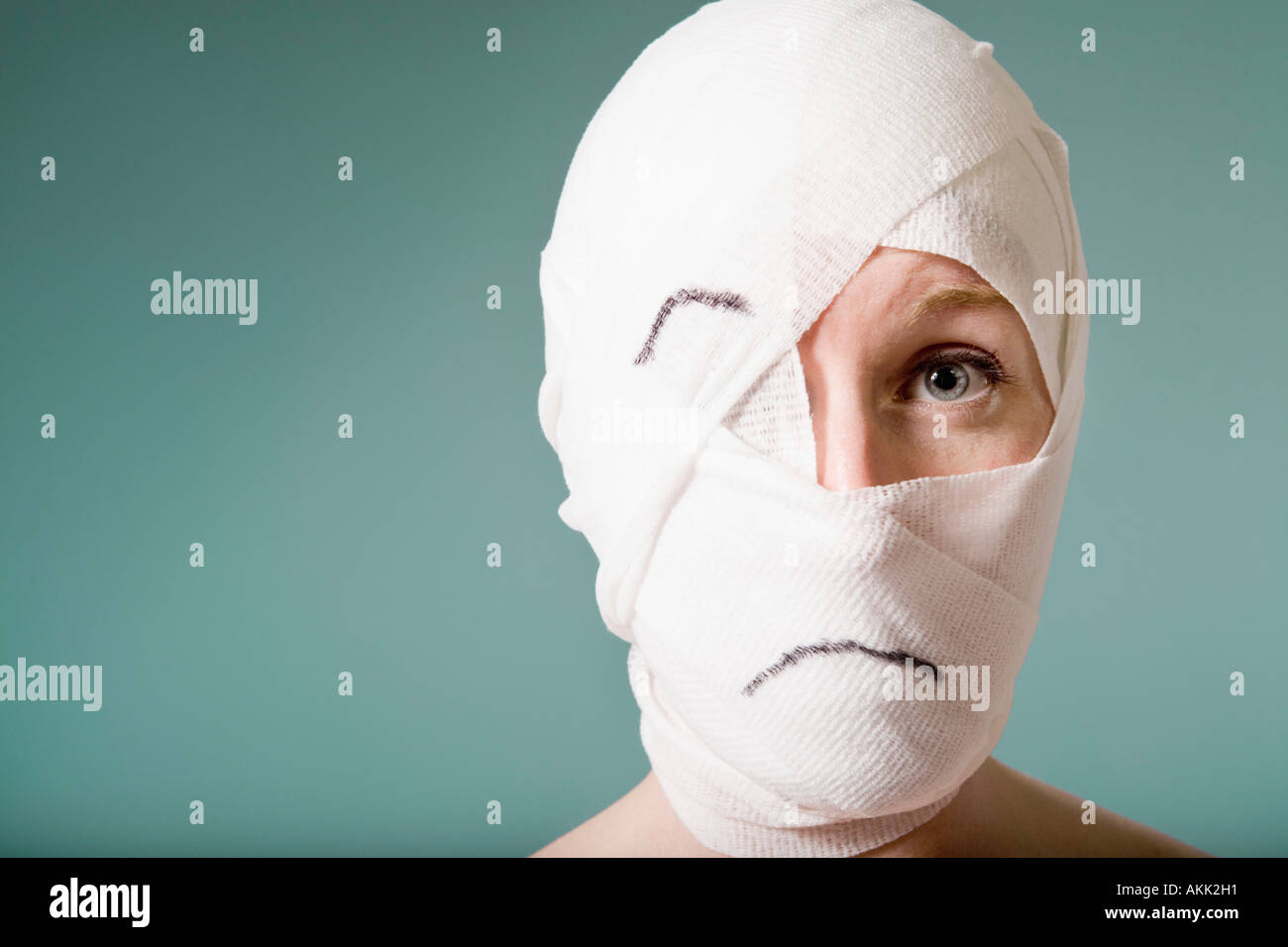 Woman head wrapped in bandage hi-res stock photography and images - Alamy