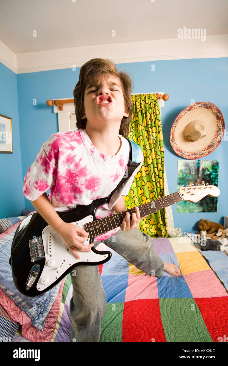 Boy playing guitar Stock Photo - Alamy