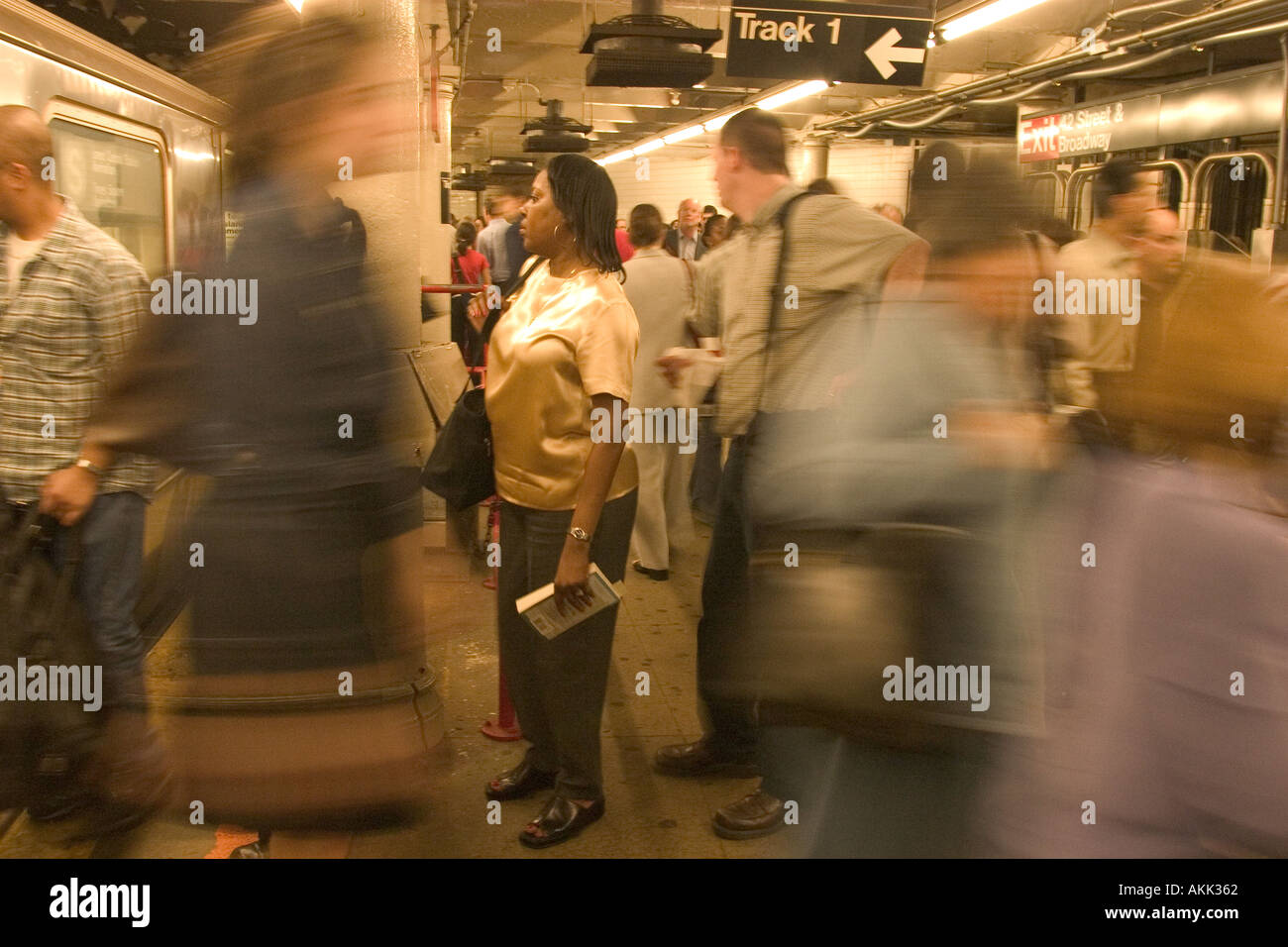 Passengers coming off the Times Square shuttle train at 42nd Street New ...