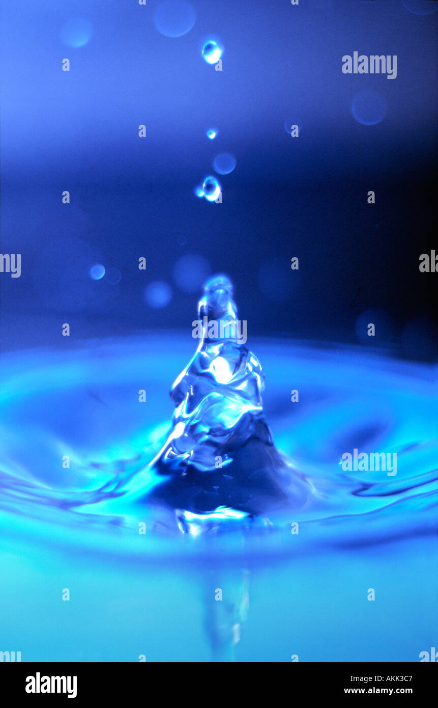 WATER DROPLET SPLASHING INTO WATER Stock Photo - Alamy