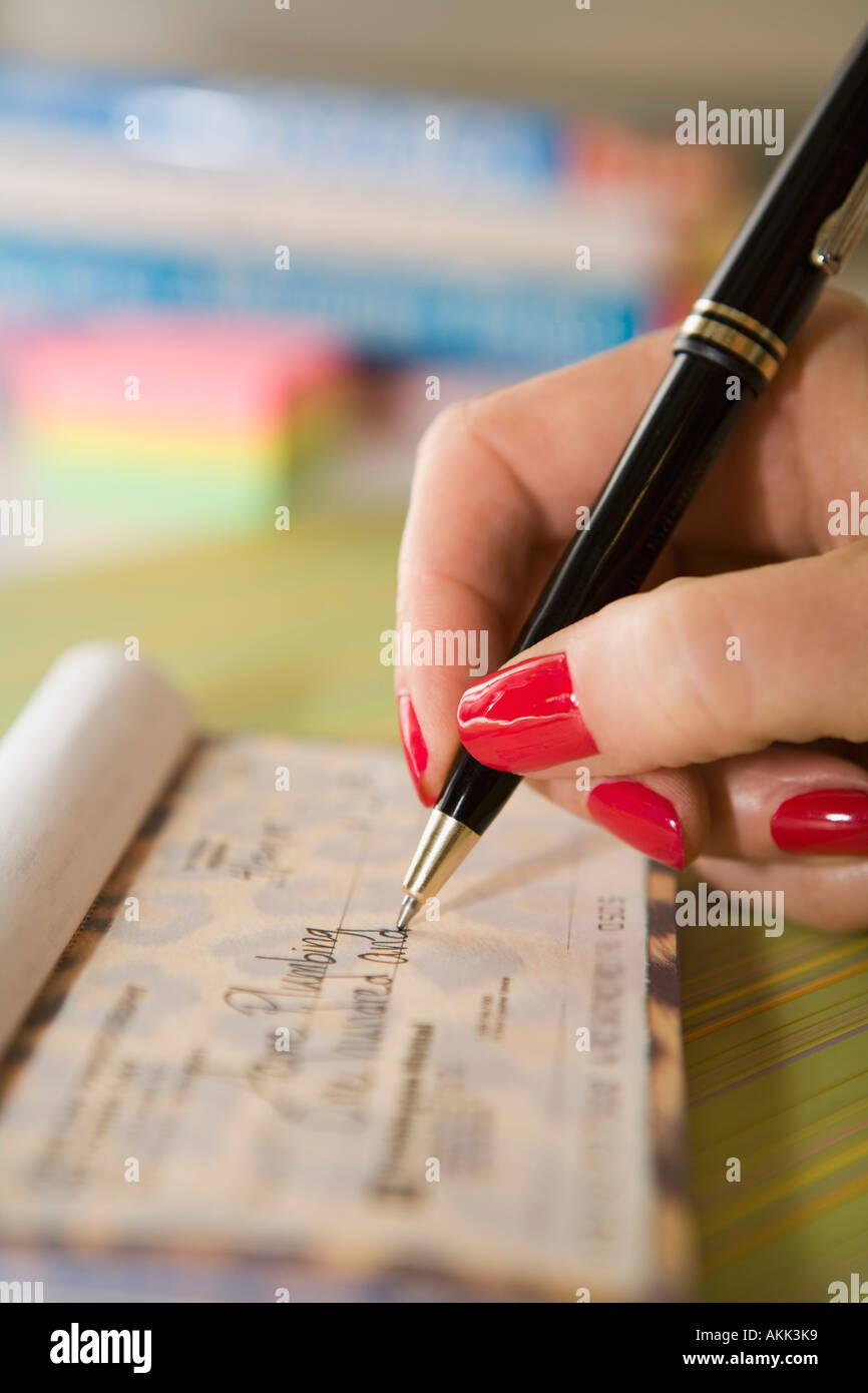 Hand writing check Stock Photo - Alamy