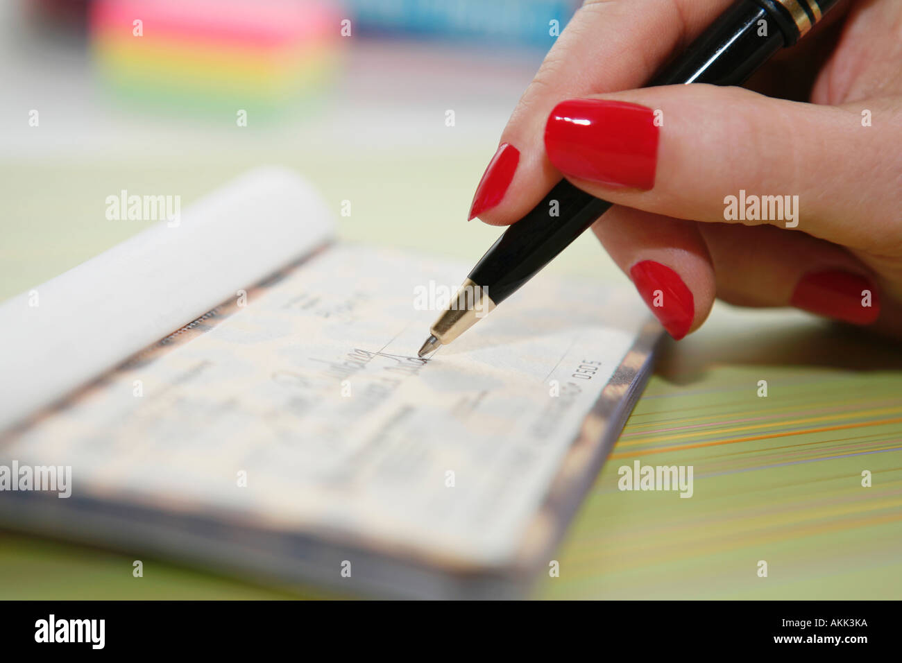 Hand writing check Stock Photo - Alamy