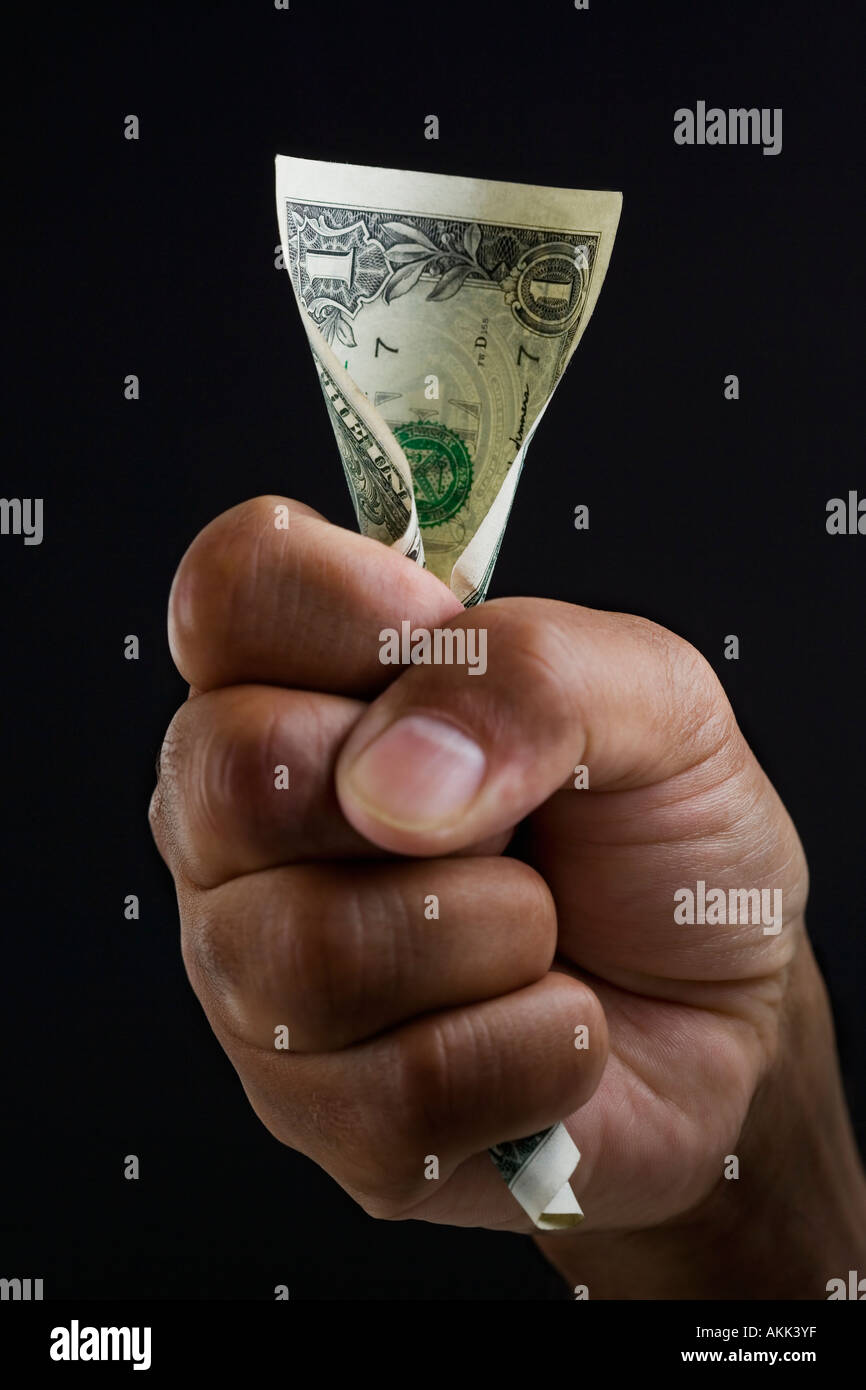 Close up of hand holding dollar bill Stock Photo - Alamy