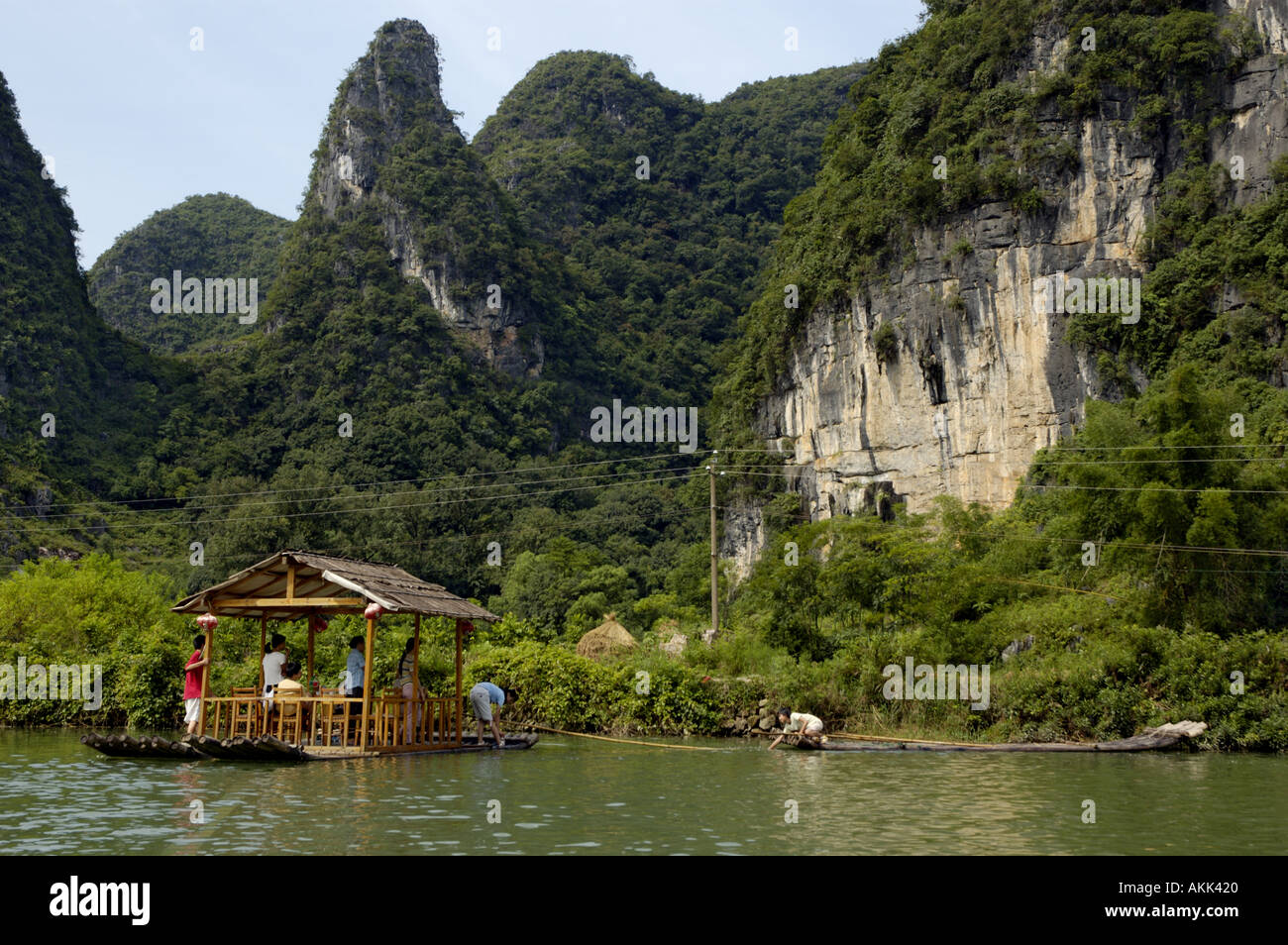 Yulong River, Guangxi, China - A Chinese family in a bamboo raft ...